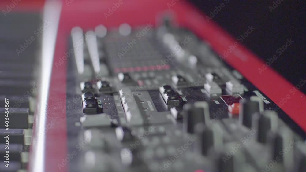 Slow motion close up of an electric stage piano synthesizer keyboards ...
