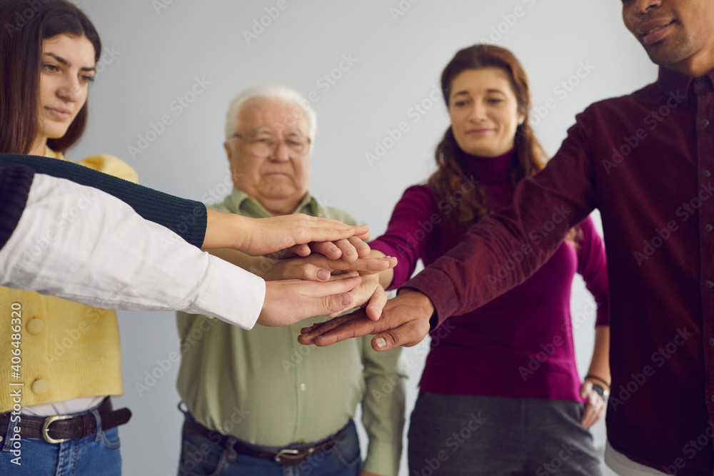 Cropped image of a group of co-workers of different ages and ...