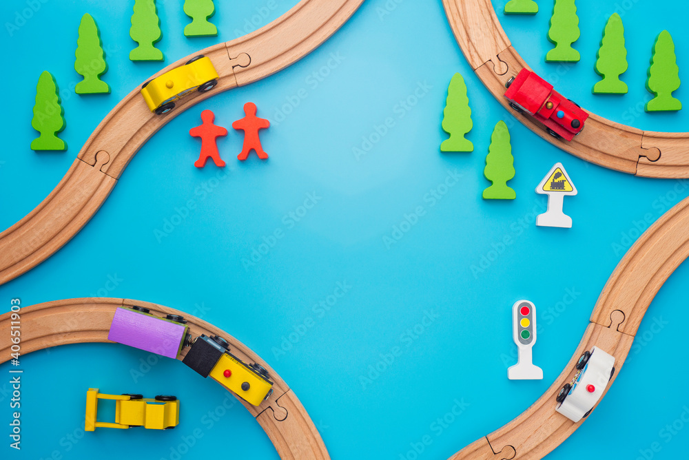 Baby kid toys background. Toy train and wooden rails on blue background ...