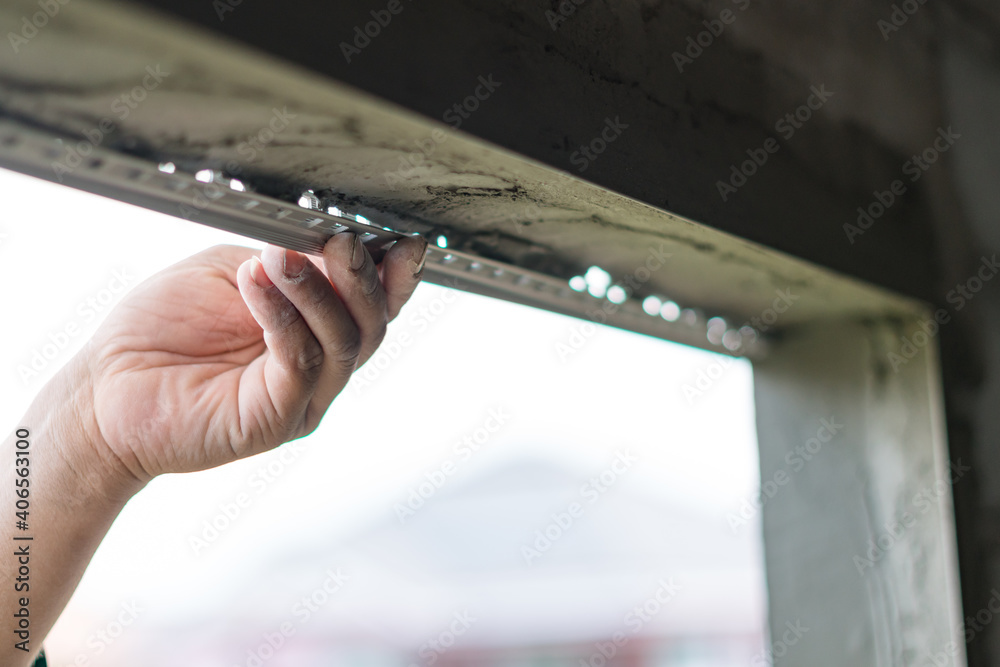 Worker labor building wall corner by UPVC groove line with plaster ...