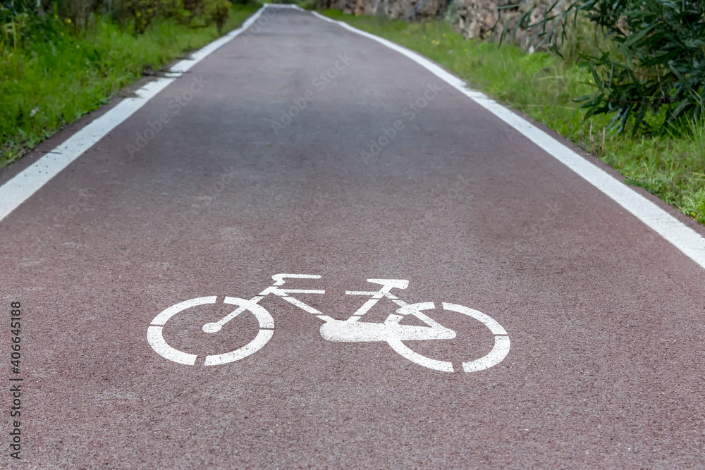 Cycle path with road signs in the woods. Stock Photo | Adobe Stock