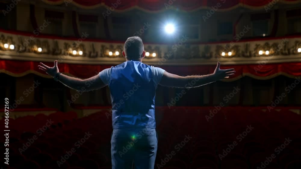 Middle age male entertainer, presenter or actor on stage. Public ...