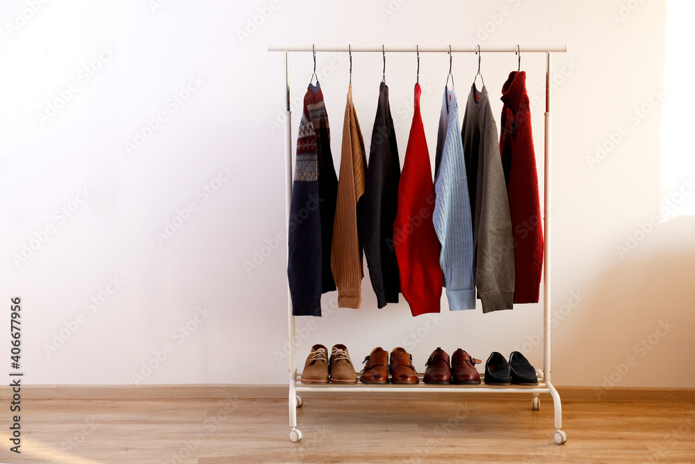 Men's hip clothing store sale concept. Row of different stylish male ...