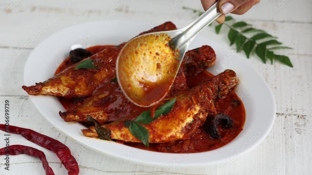 Spicy Mackerel fish curry gravy , cooking spicy Kerala fish curry ...