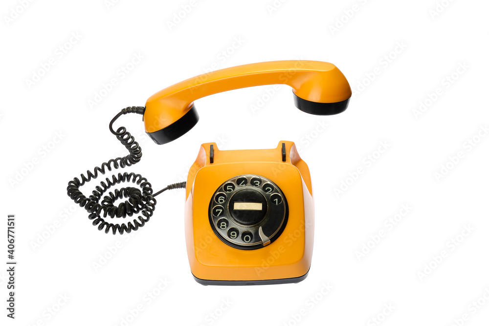 Old, orange rotary dial telephone with hanging receiver, isolated on ...