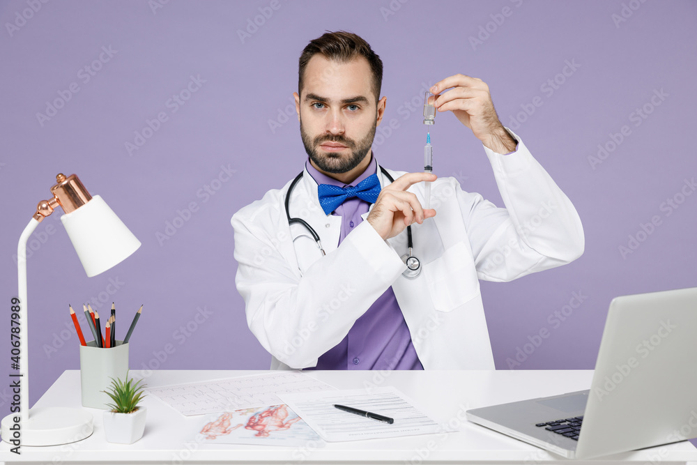 Confident nurse male doctor man wear white medical gown suit sits at ...