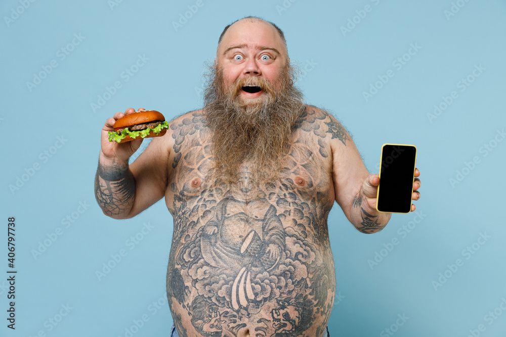 Shocked fat pudge obese chubby overweight man has tattooed big belly ...