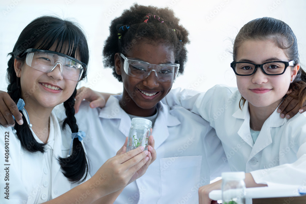Three friends of different religions in biology lab, tissue culture ...