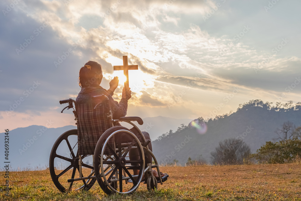 Disabled handicapped woman sitting on her wheelchair and hold the ...