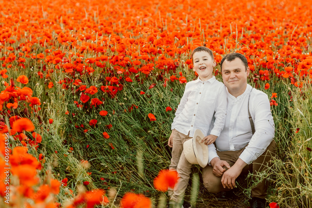 person in poppy field. Little happy boy in a hat in a poppy field ...