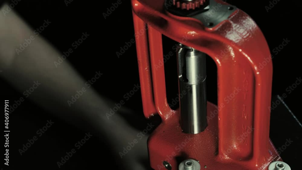 Vidéo Stock Red hand press and ammo shell against dark background, soft ...