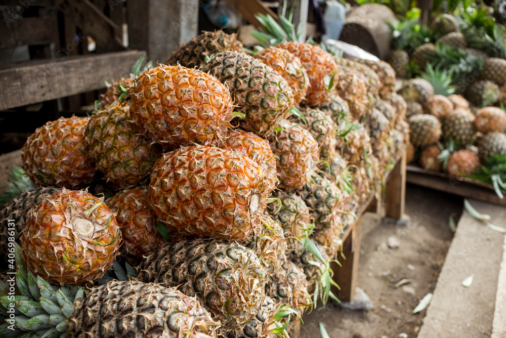 Foto de A stack of locally harvested pineapple for sale at a local ...