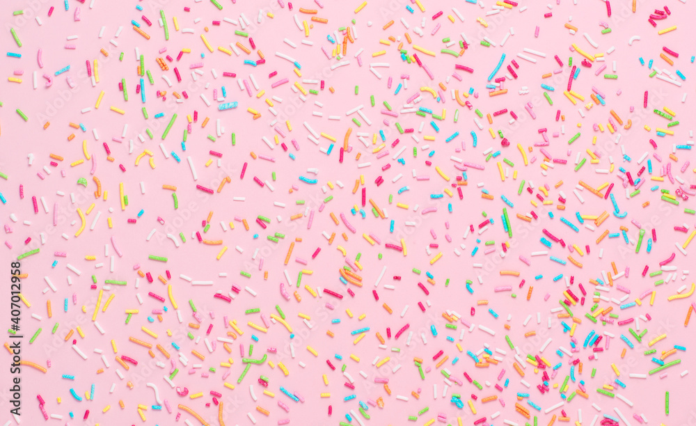rainbow sprinkles on pink background Stock Photo | Adobe Stock