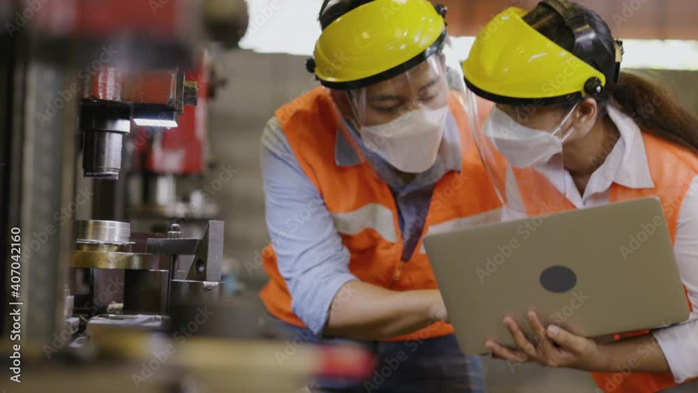 Group Machine engineer wear mask and face shield while working in ...