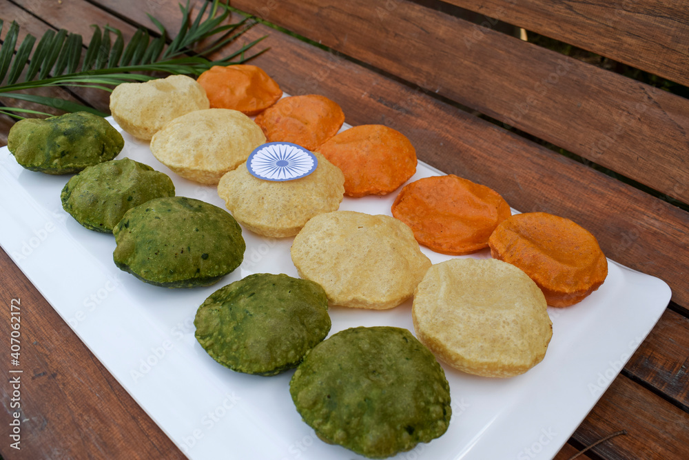 India tricolor / tricolour food breakfast of spinach puri, carrot puri ...