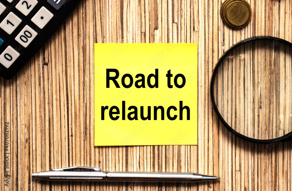 Text Road to relaunch in yellow notes with pen Stock Photo | Adobe Stock