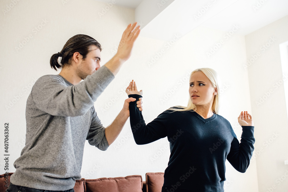 Violence at home - aggressive man beating his wife. Woman victim of ...