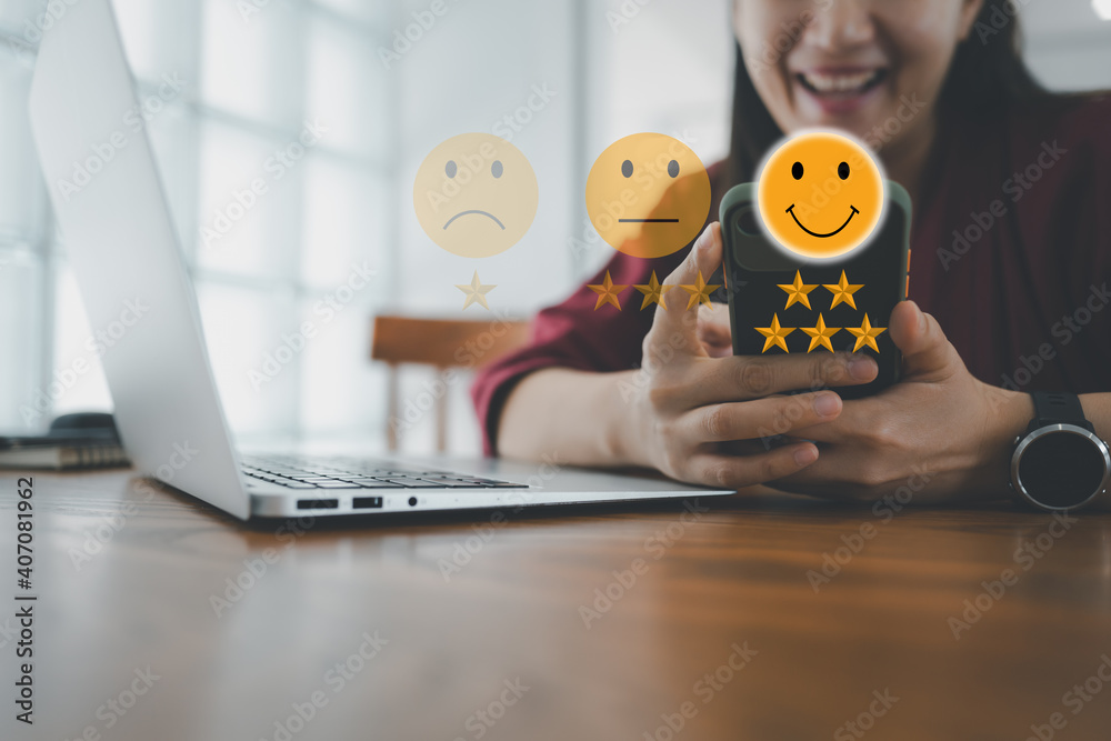 Customer service evaluation concept. smiling Asian female Is using a ...