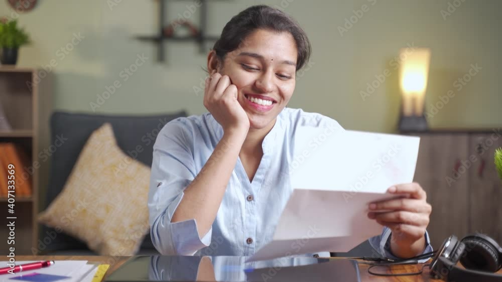 Young business woman reading paper letter feeling overjoyed and ...