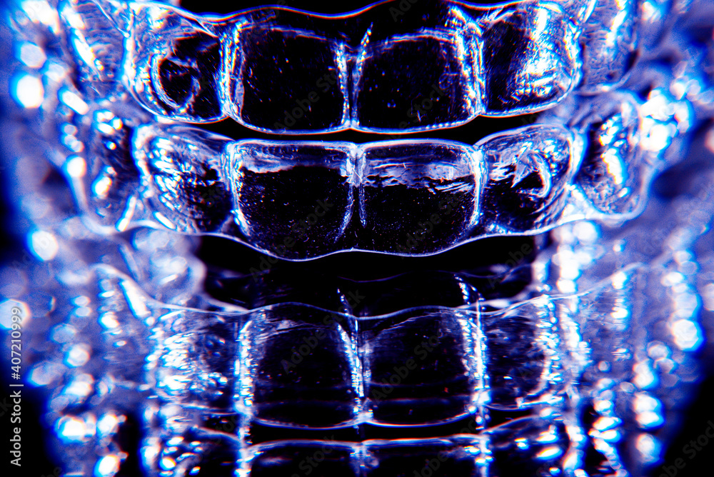 Invisible dental teeth brackets tooth aligners on black background ...