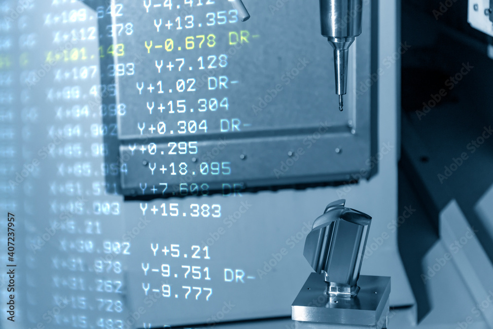 Abstract scene of CNC milling machine and G-code data background. The ...