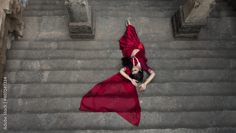 Portrait of beautiful Indian girl in heritage stepwell wearing ...