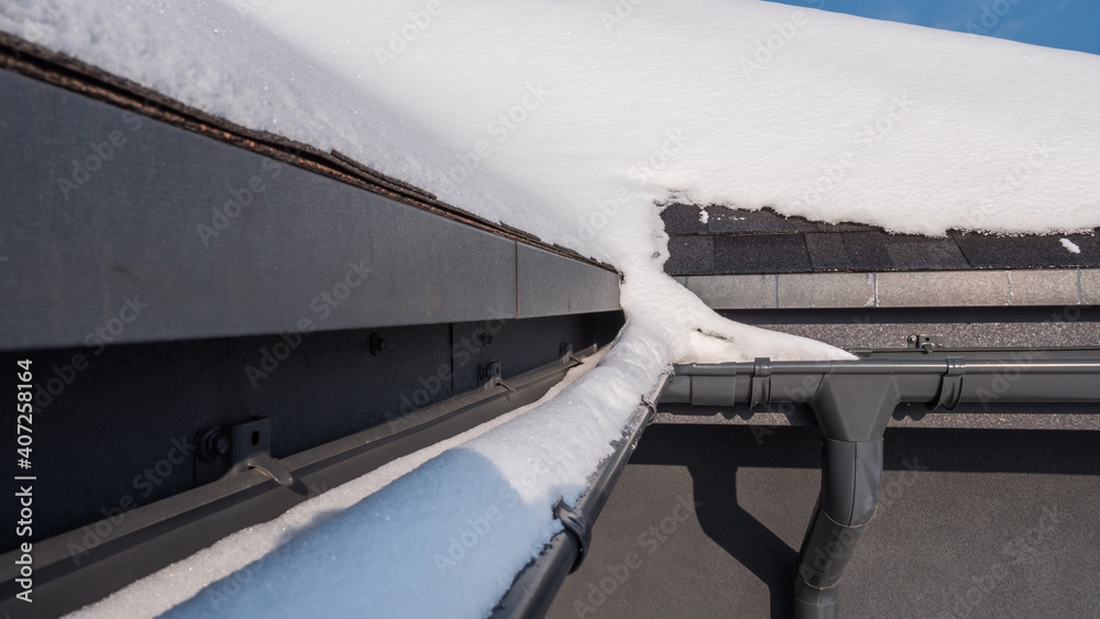 Snow on the roof and in the gutter. Engineering systems for drainage of ...