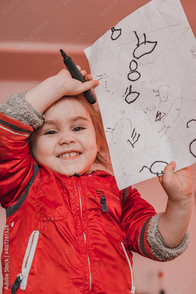 Preschool girl learns to draw a circle, black circles on a white sheet ...