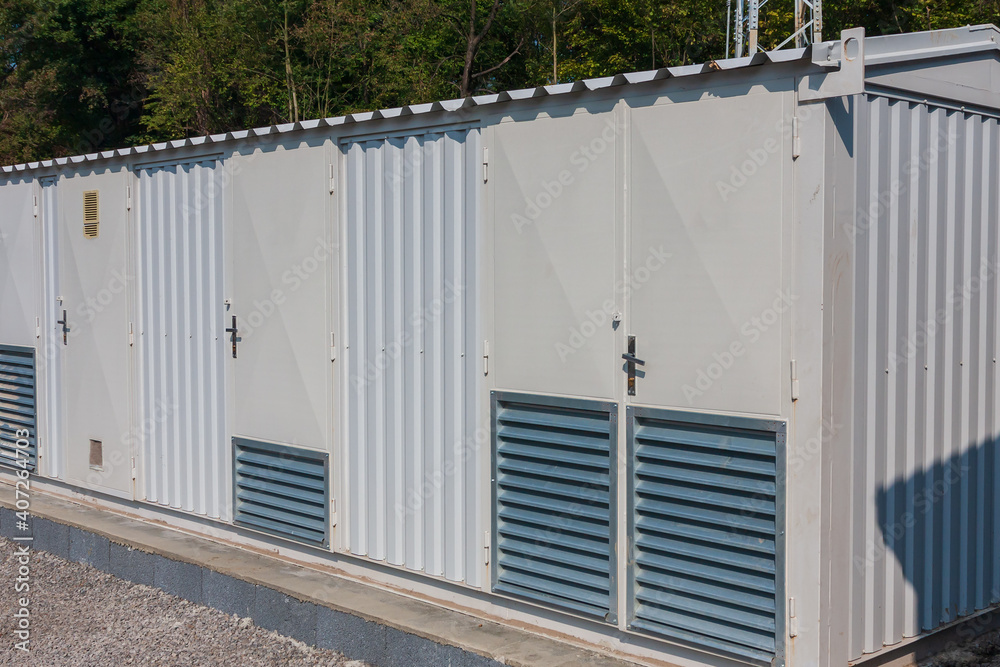 Gray metal shed, which serves as a transformer station of high ...