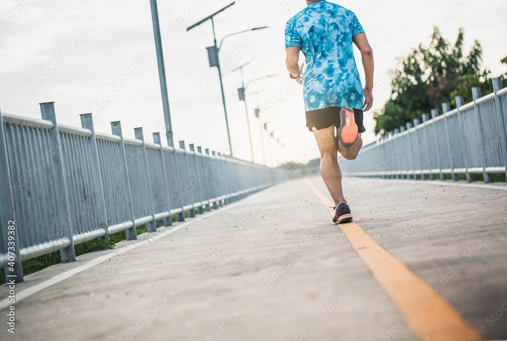 Young man running in the city. Healthy lifestyle concept. Young fitness ...