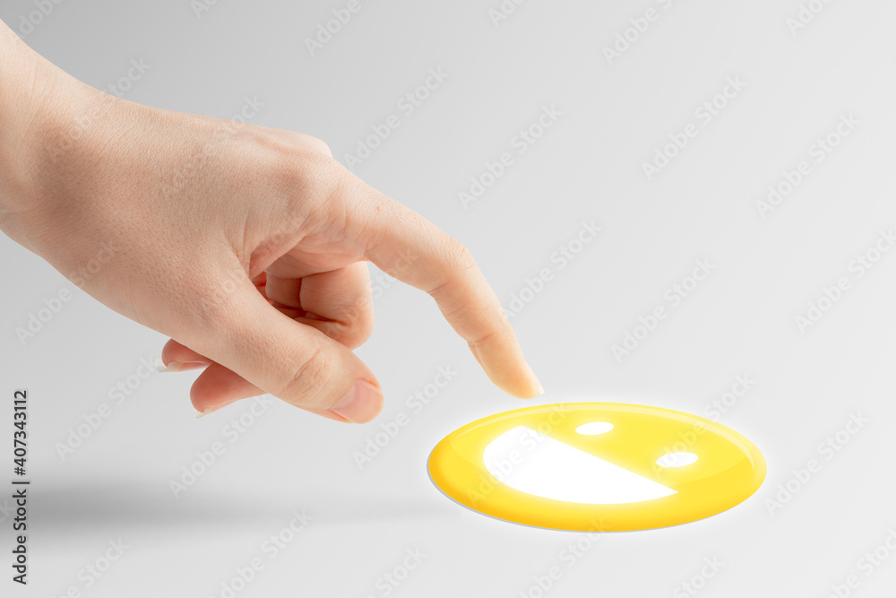 Foto de Closeup hand clicking smiley emoticon social media reaction do ...