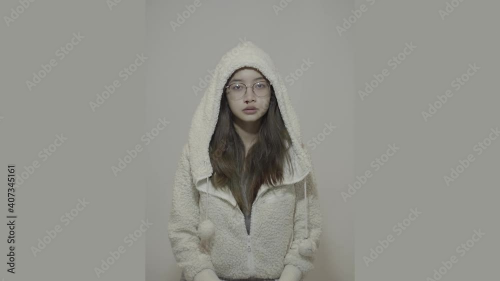 Portrait of a young woman sick and worried with a bleeding nose ...