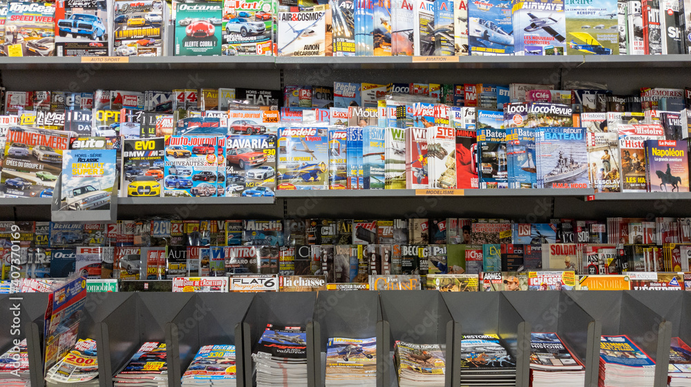 magazines and newspapers on store shelves of the press shop Stock Photo ...