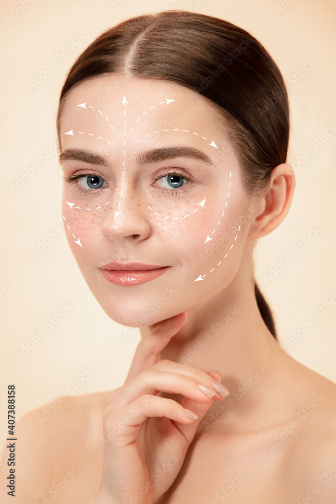 Beautiful female face with lifting up arrows isolated on studio ...