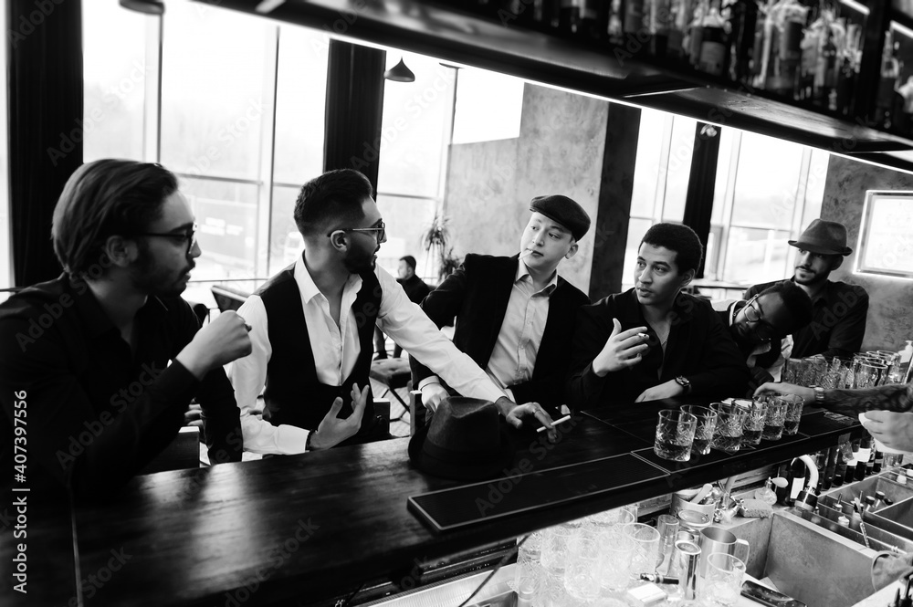 Group of handsome retro well-dressed man gangsters spend time at club ...
