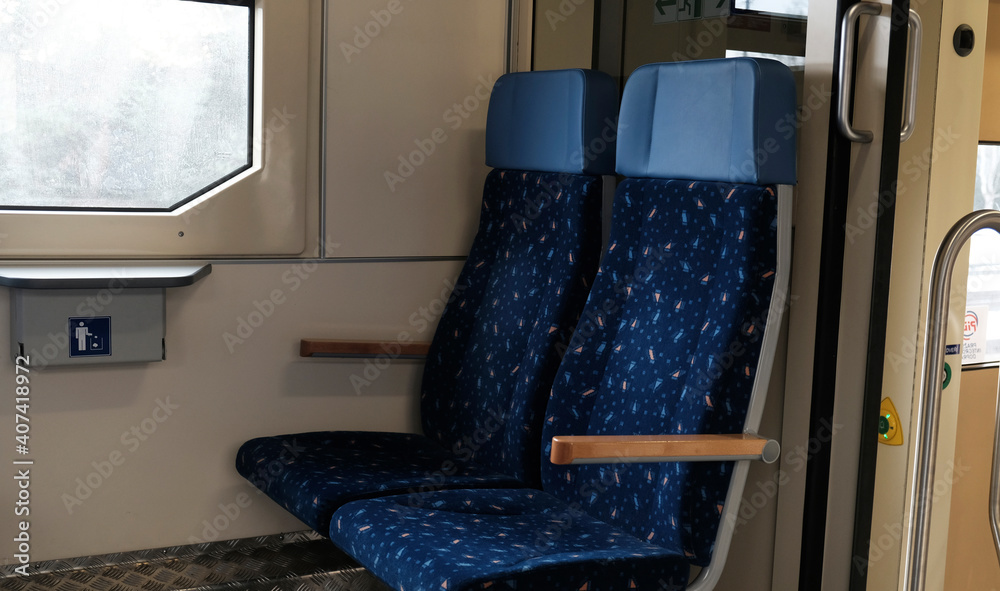 Train chairs and view through window. Comfortable chairs on a modern ...