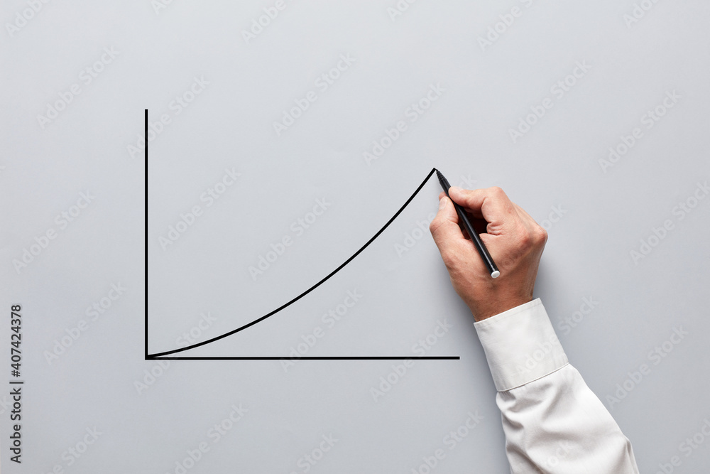 Businessman hand drawing a chart or line graph with an increasing slope ...