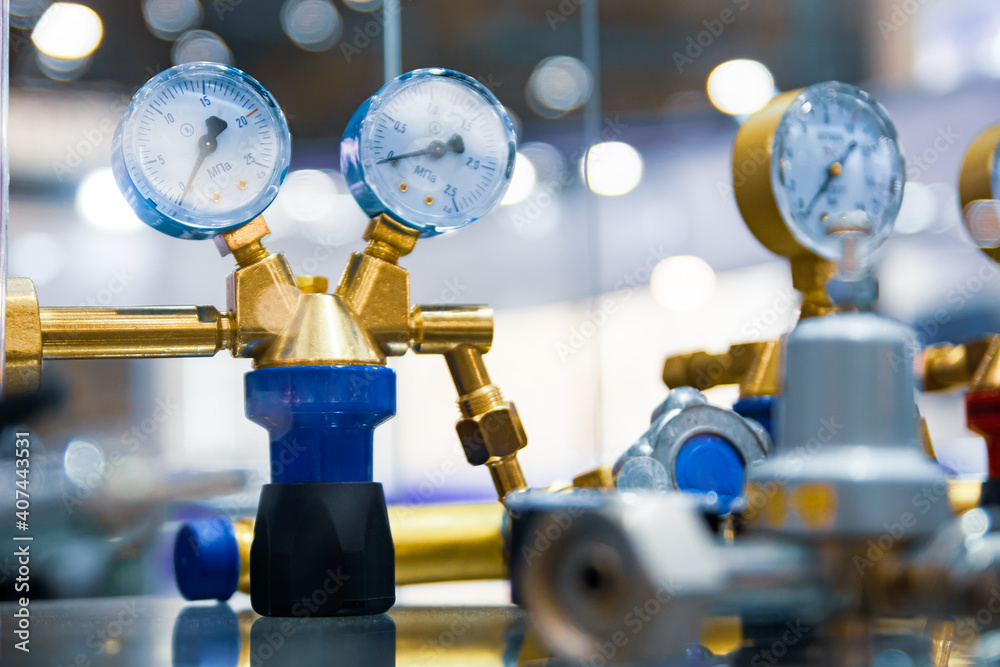 Cylinder gas reducers with pressure gauge Stock Photo | Adobe Stock
