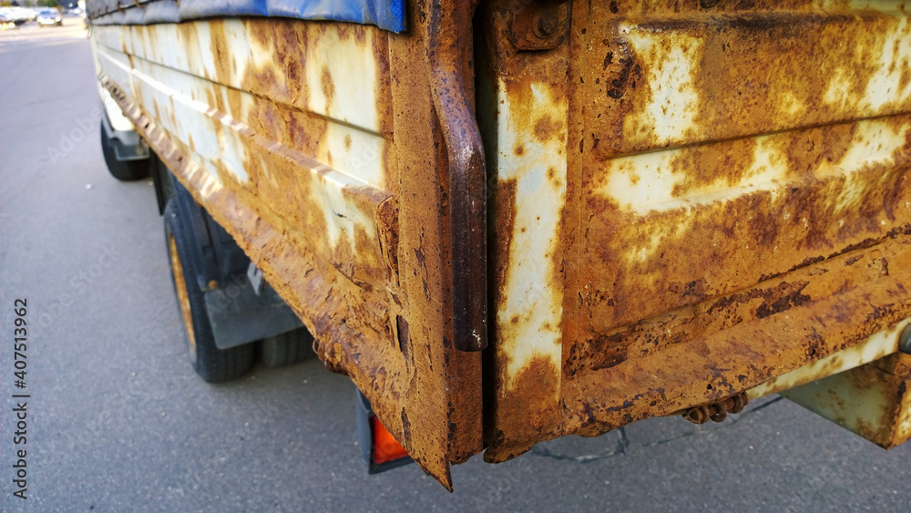 Sheet metal corrosion of body of an old truck. Rusty surface ...