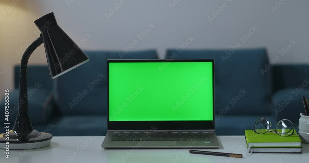 Vidéo Stock working table in home office with laptop, lamp, book and ...