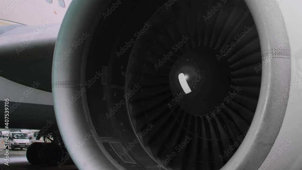 Airplane jet engine and landing gears moving forward. Engine of ...