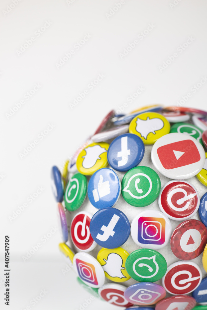 Various logos of social media providers are combined on one sphere ...