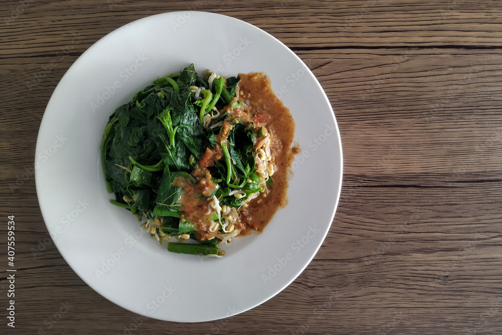 Nasi pecel Indonesian traditional food vegetables with peanut sauce ...