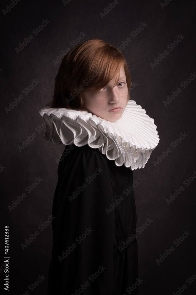 Classic renaissance portrait of red headed boy in black wearing a large ...