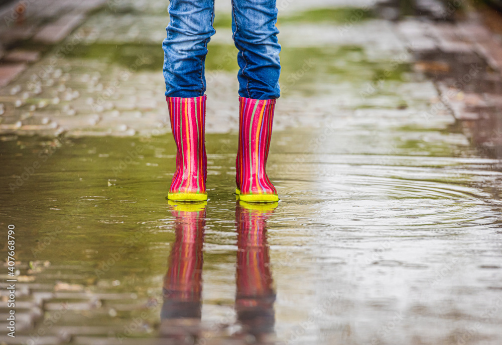 Girls legs in cute rubber boots Stock Photo | Adobe Stock