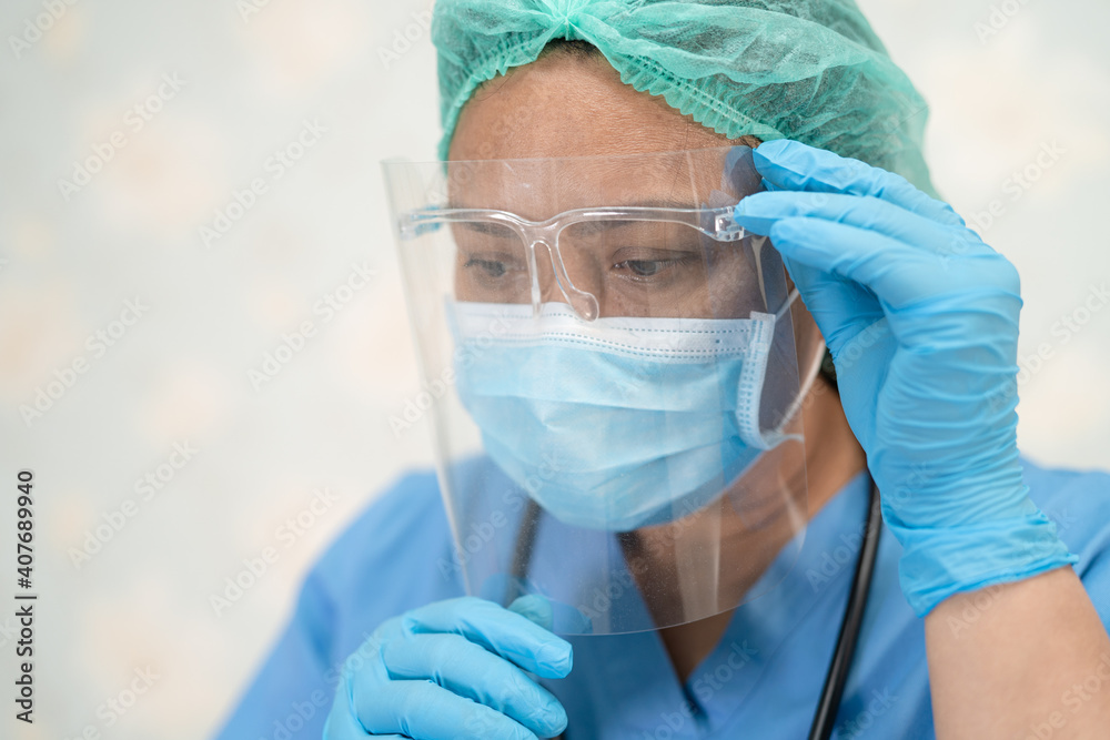 Asian doctor wearing face shield and PPE suit new normal to check ...
