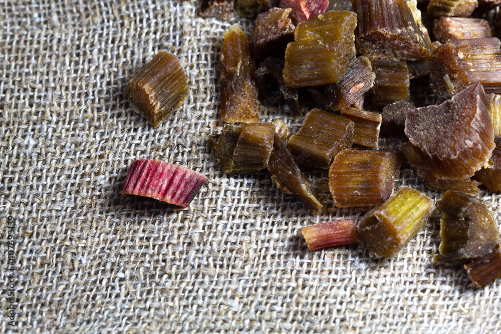 Dried rhubarb candied fruits. Candied rhubarb on a canvas fabric ...