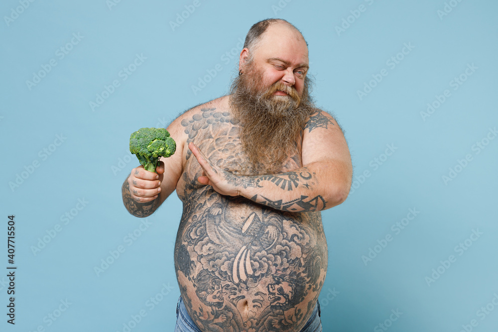 Disgusted fat pudge obese chubby overweight man has tattooed big belly ...