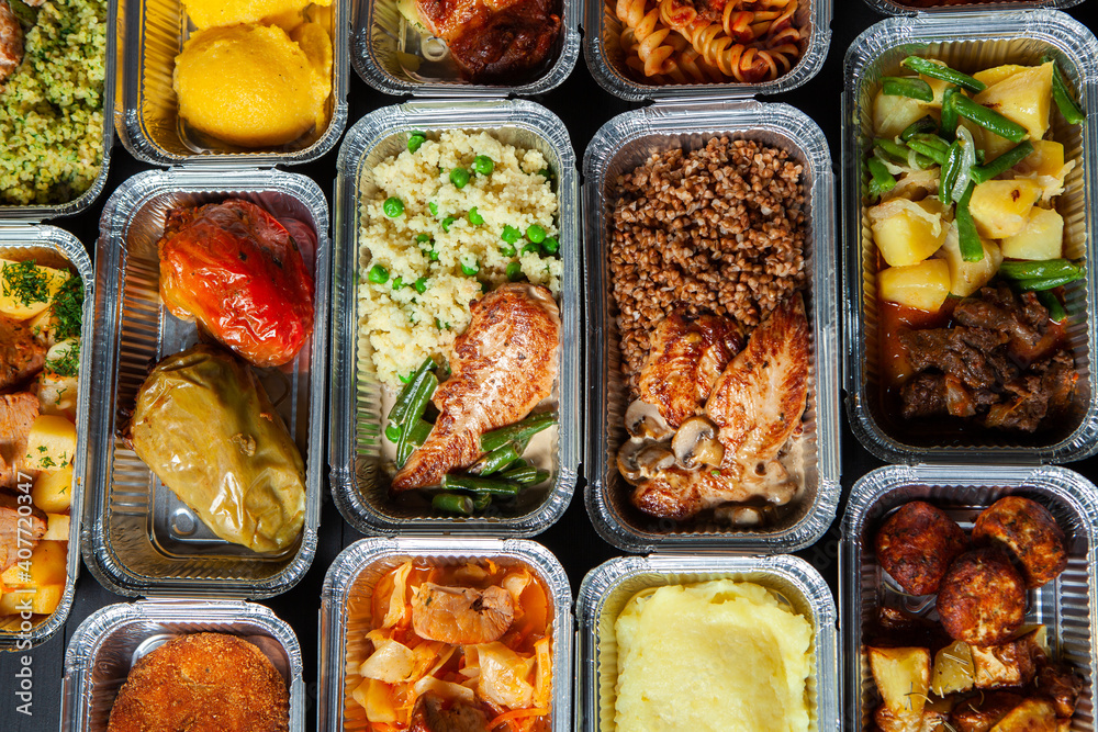 Business lunch in eco plastic container ready for delivery.Top view ...