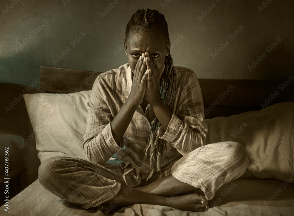 dramatic home portrait of young sick and depressed black African ...